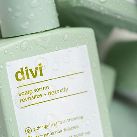 close up photo of divi scalp serum revitalize + detoxify green bottom